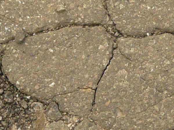 cracked road with rocks texture 0016 - Texturelib