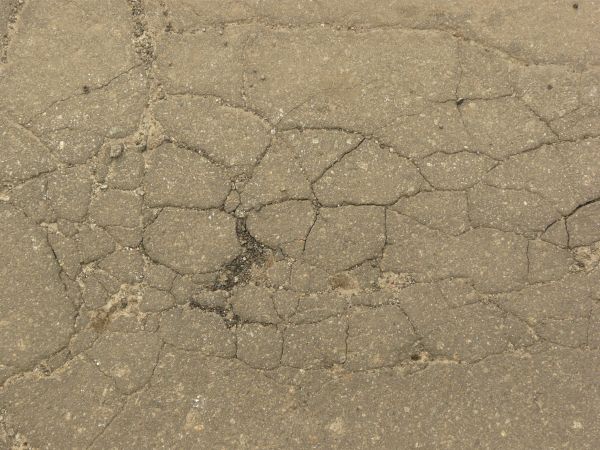 cracked road with rocks texture 0016 - Texturelib